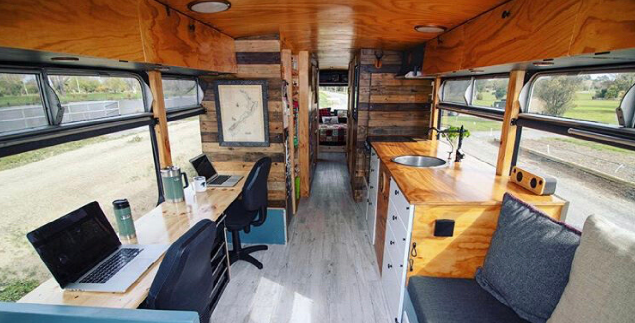 Sleep High Country in this Rustic skoolie bus conversion