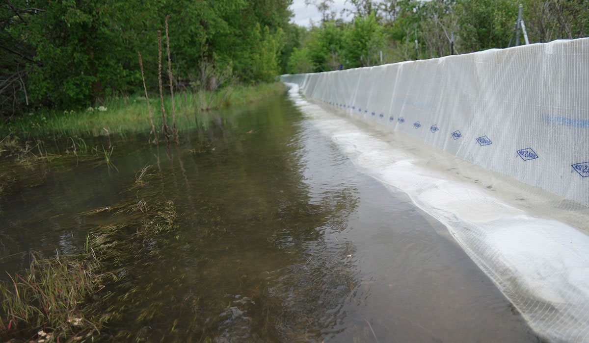 Final Muscle Wall in place to protect Eagle Island gravel pit from flooding