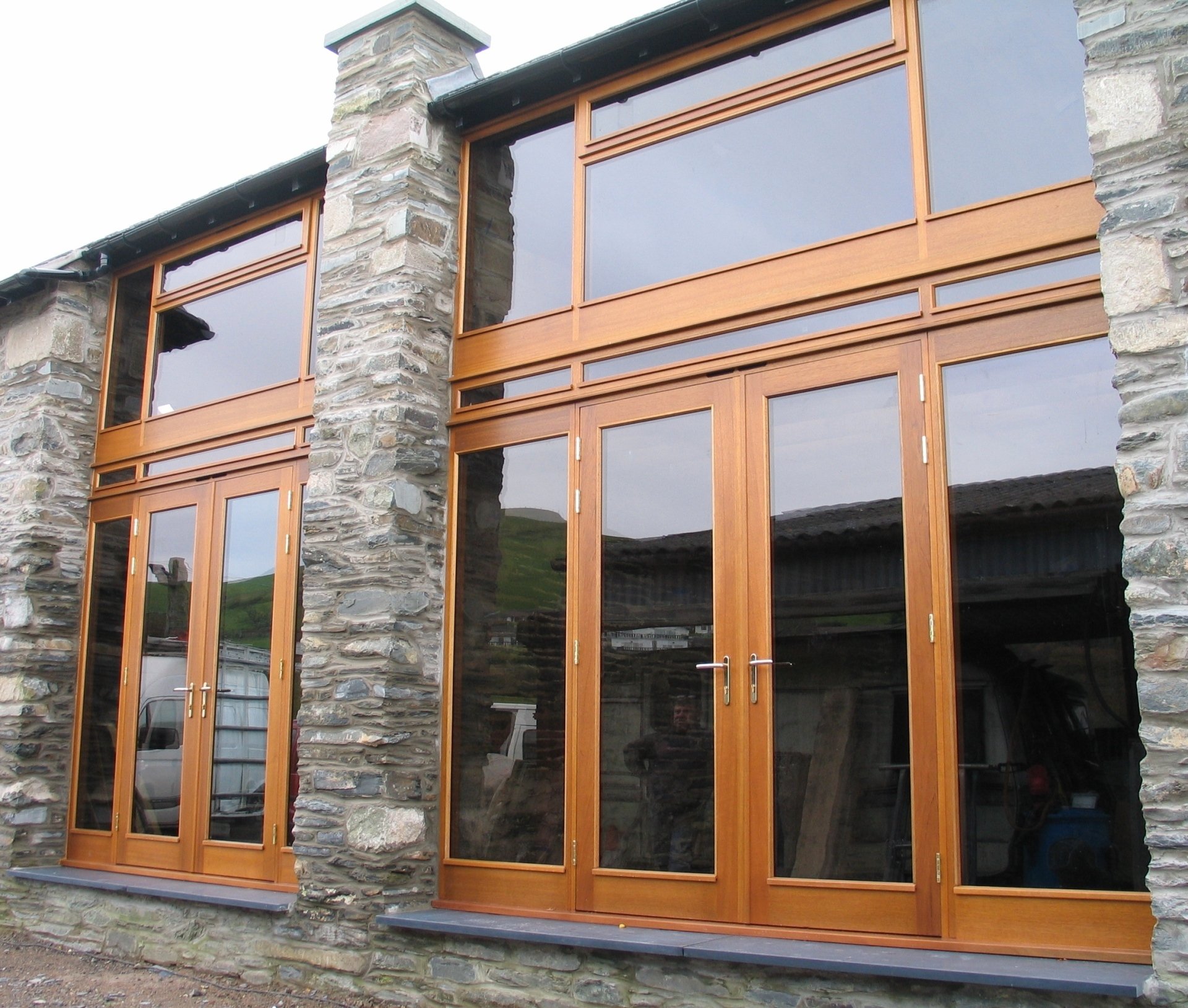 Timber bi-folding bespoke manufactured doors - CPJoinery