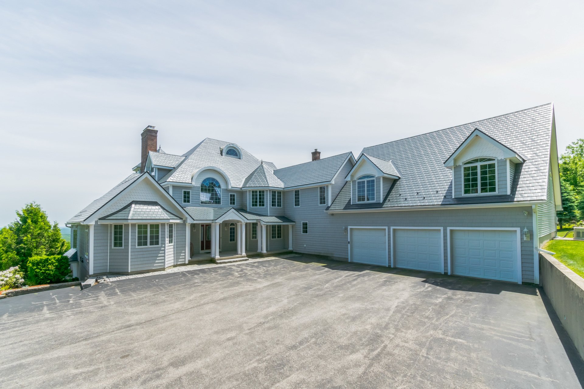 Black Interlock Metal Slate Roofing System Installed on Rochester, NH Home