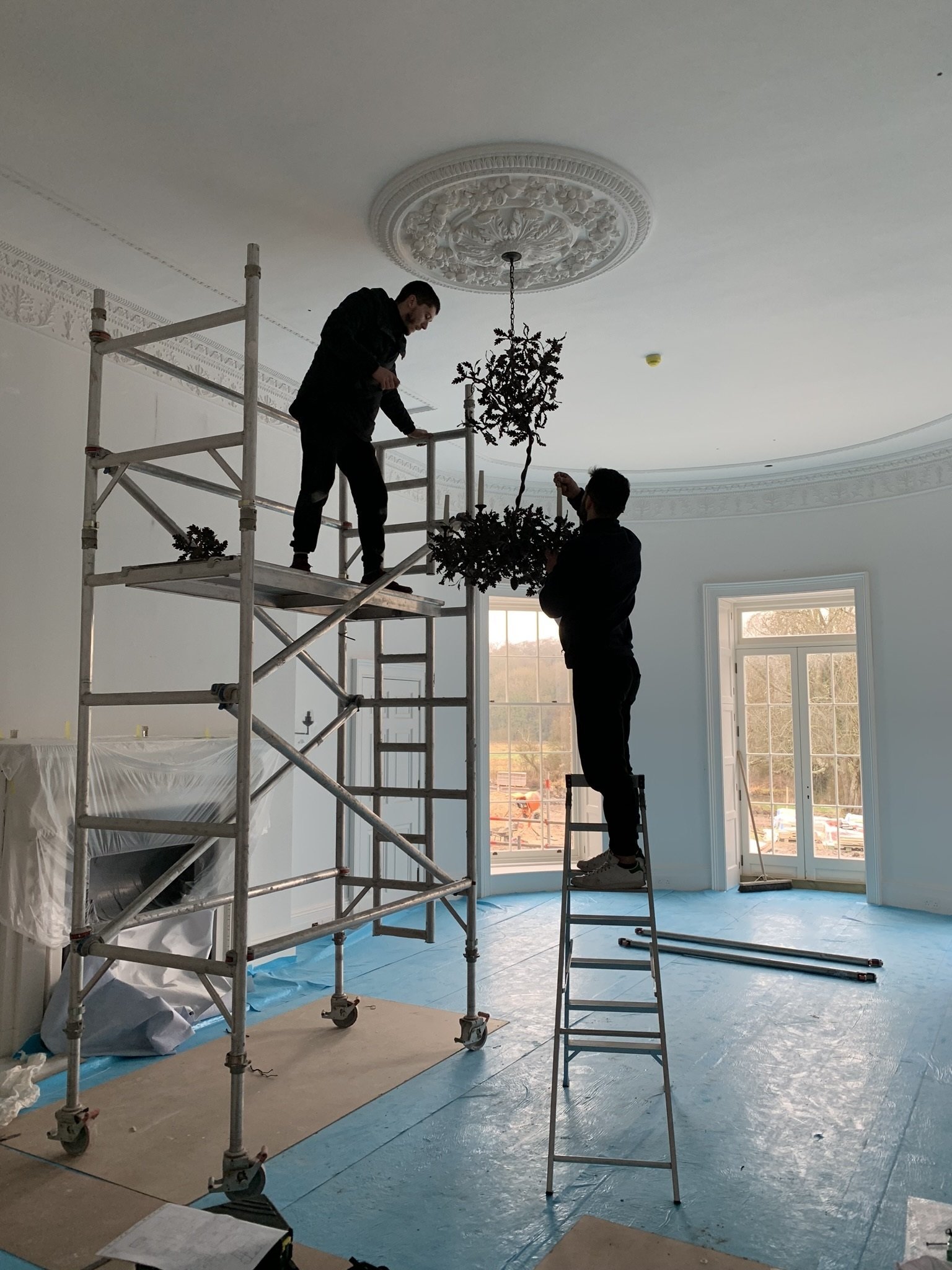 Chandelier installation | Bluebird Carriers