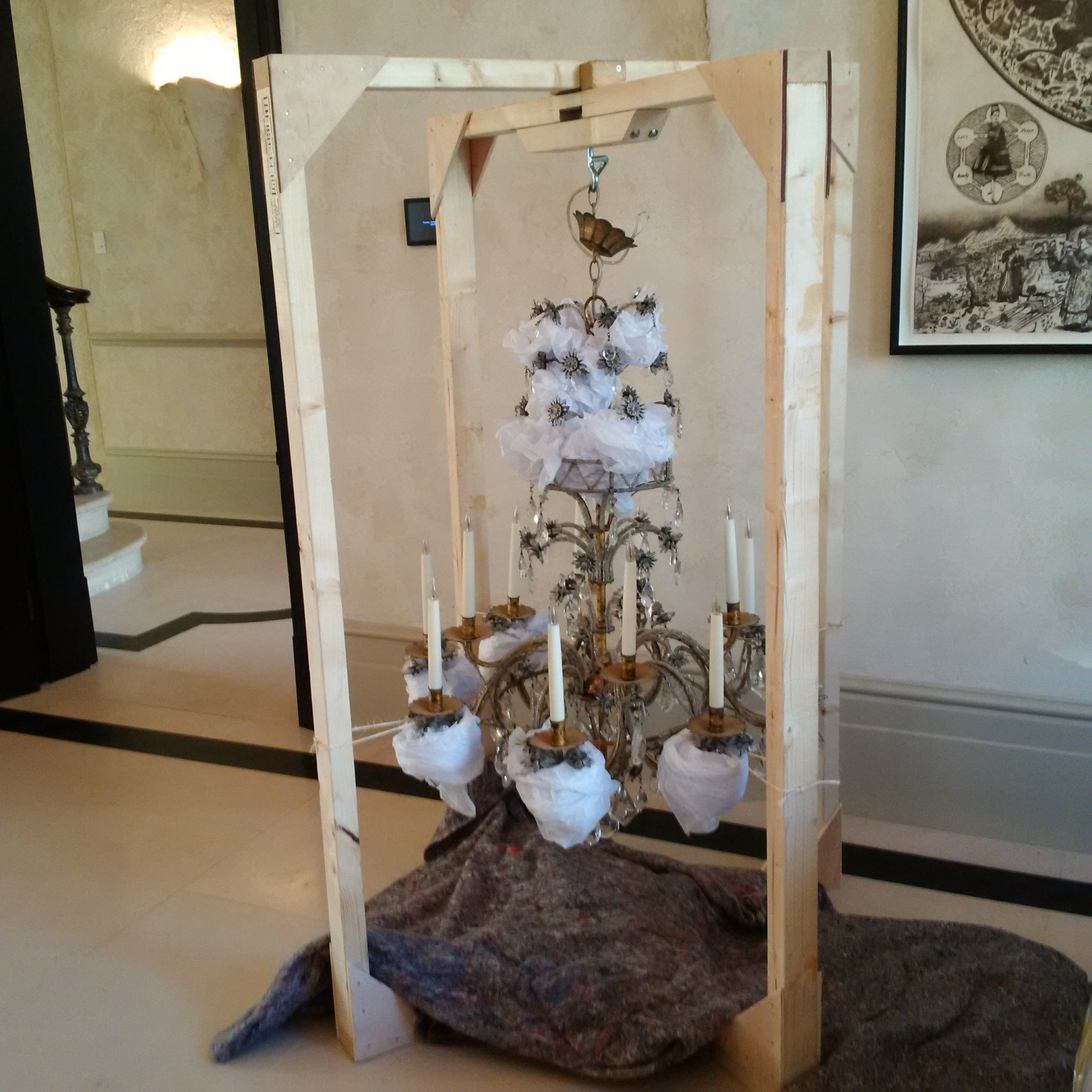 Chandelier installation | Bluebird Carriers