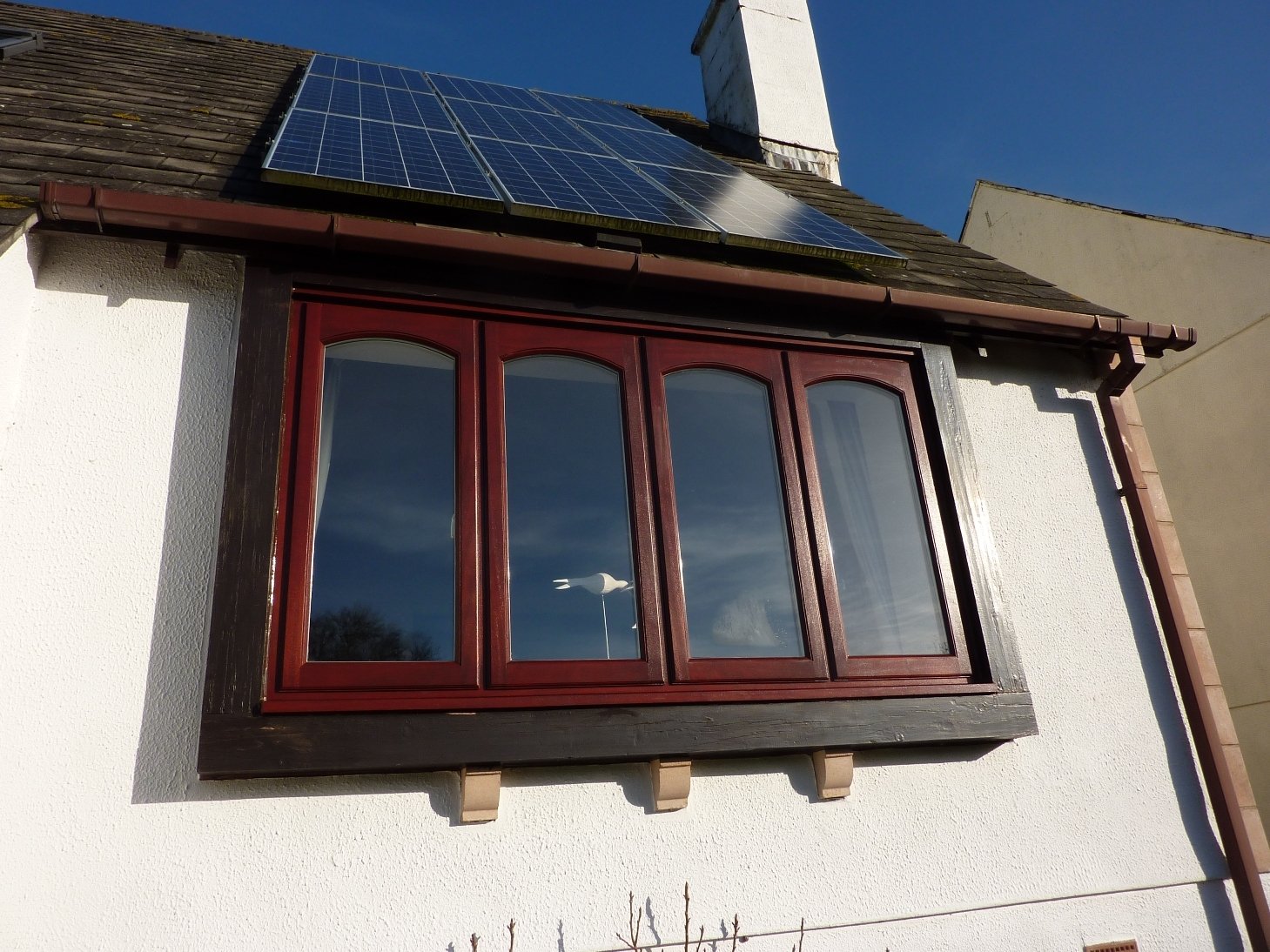 Hardwood crescent head double-glazed replacement windows in Devon