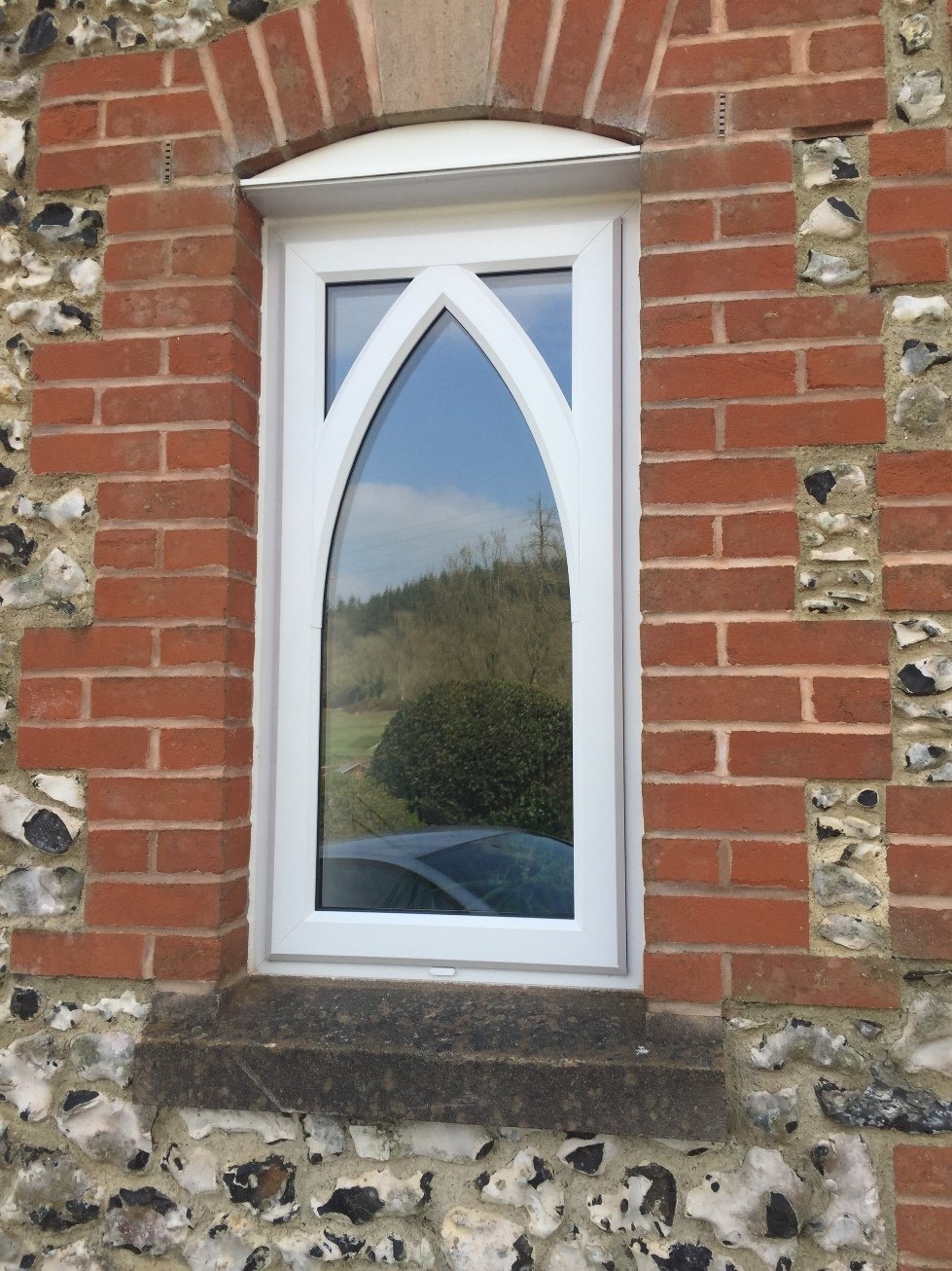 uPVC gothic arched windows in Devon. Shaped PVC double-glazing experts