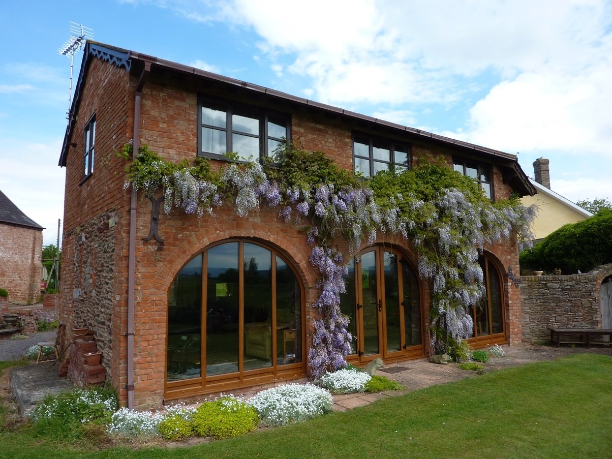 uPVC arched windows. Curved PVCu windows in Devon