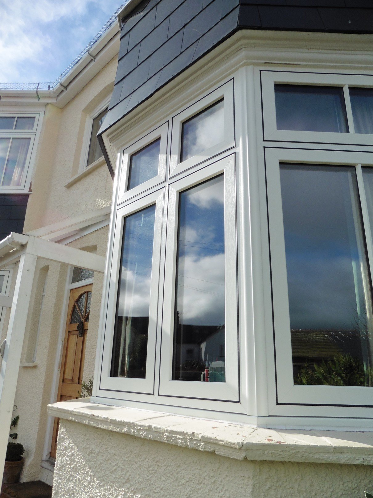 Flush hung PVC timber look windows installed in Exmouth, Devon