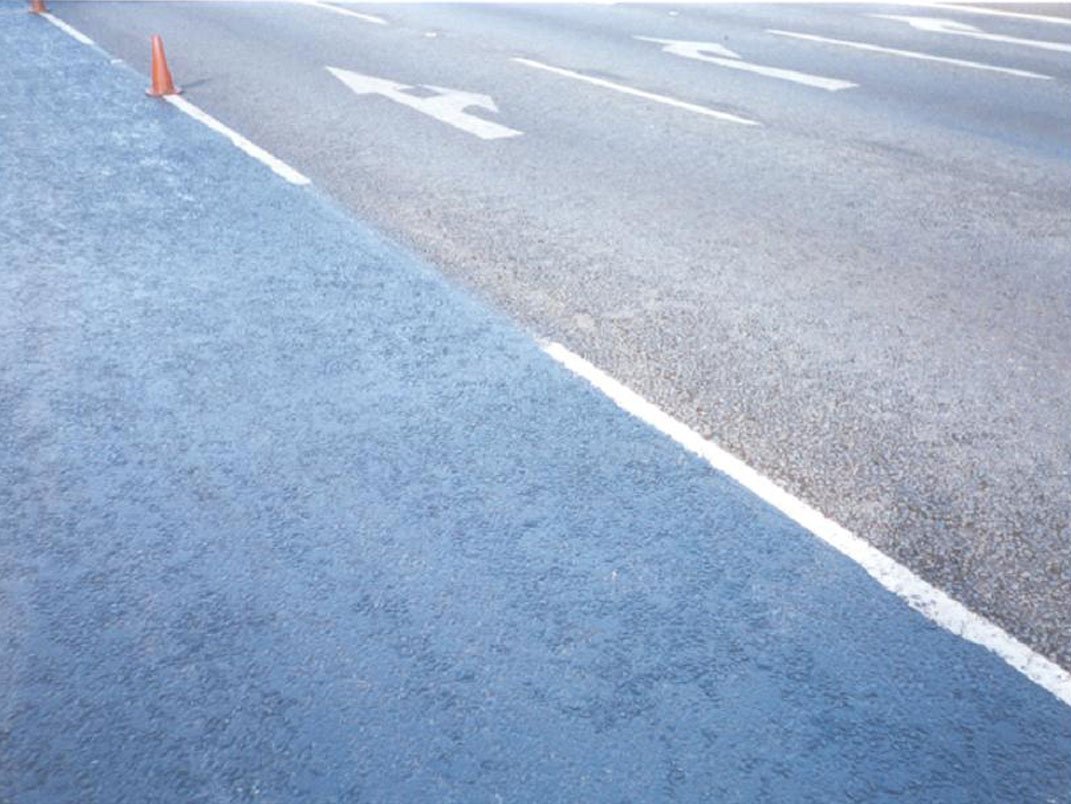 Rapid curing rejuvenating top layer road sealant.