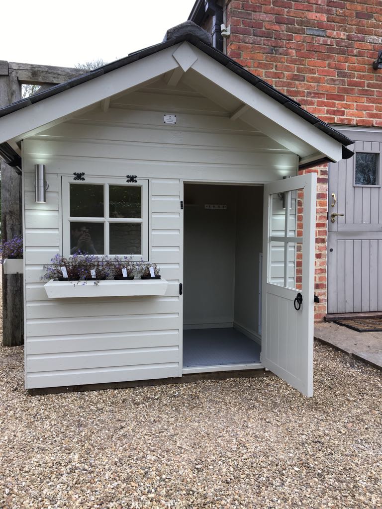 A selection of our beautiful, bespoke heated and lit dog cottages