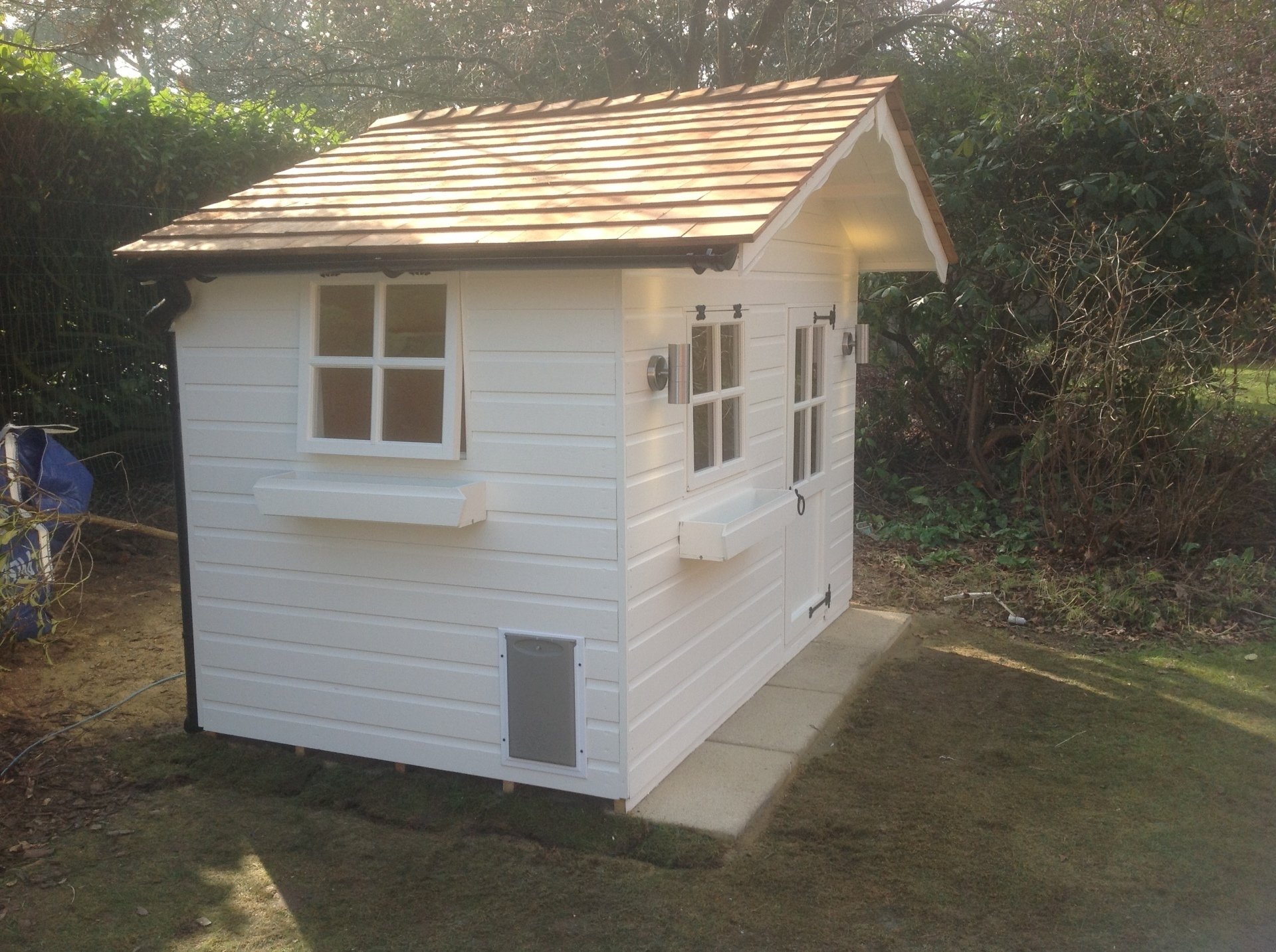 A selection of our beautiful, bespoke heated and lit dog cottages