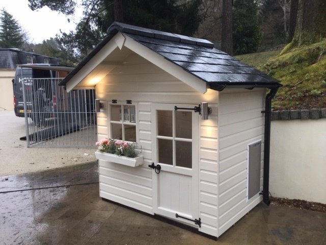 A selection of our beautiful, bespoke heated and lit dog cottages